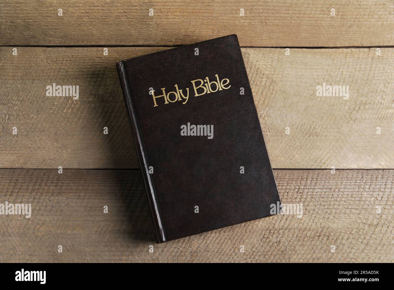 Holy Bible on wooden table, top view Stock Photo - Alamy