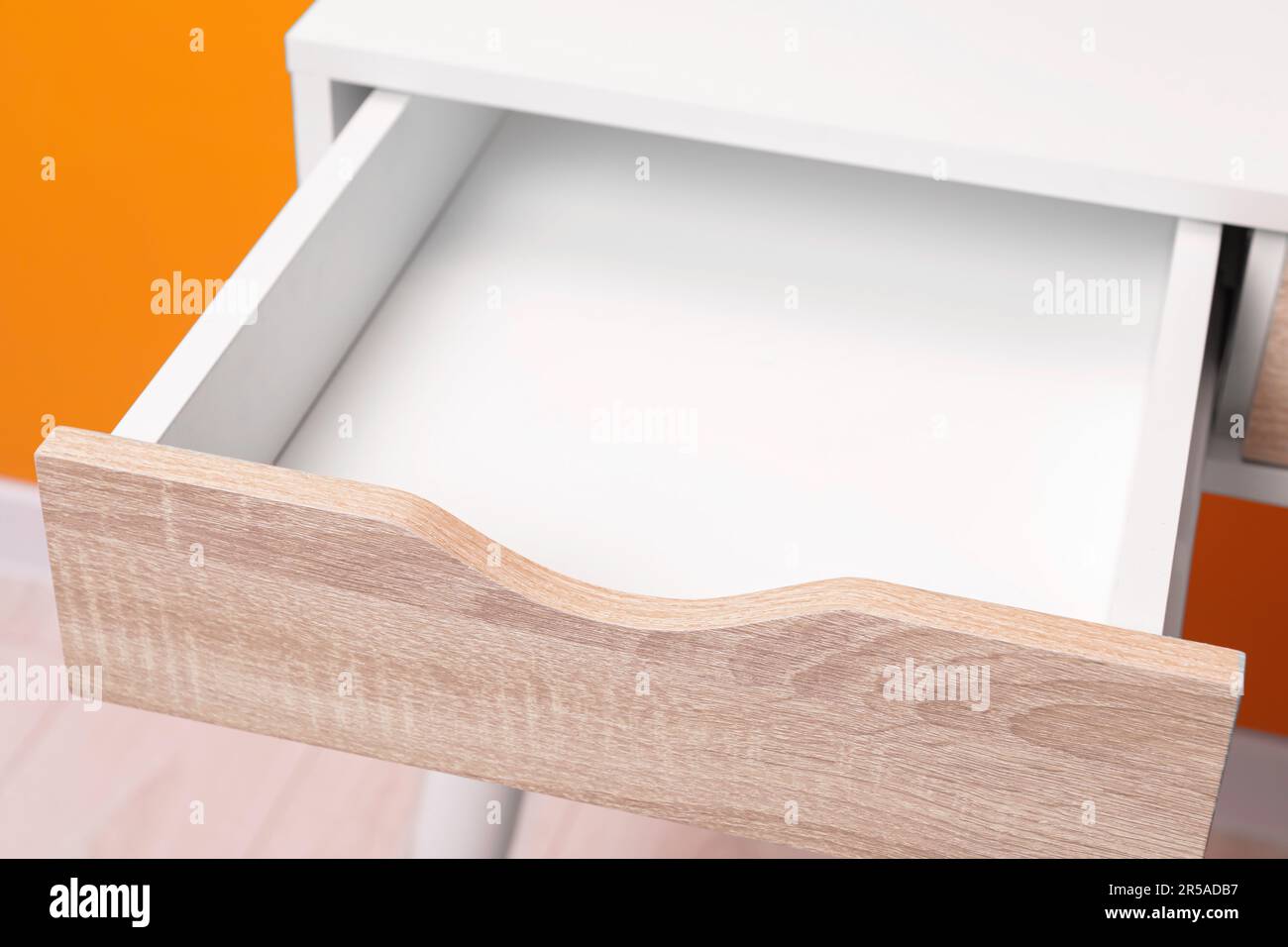 Stylish desk with open empty drawer in office, closeup Stock Photo - Alamy