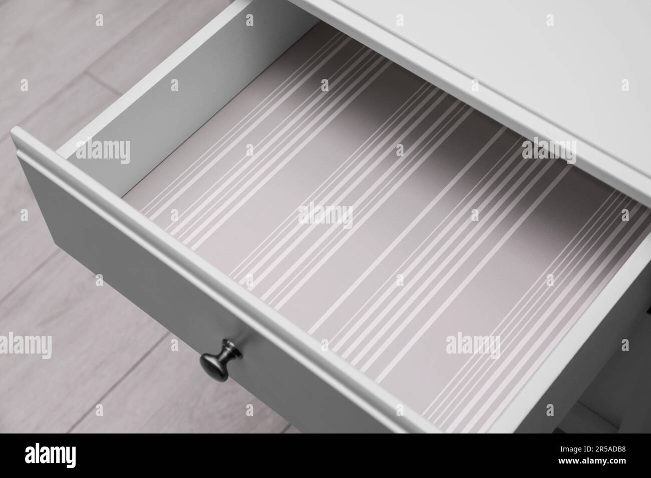 Stylish desk with open empty drawer, above view Stock Photo - Alamy