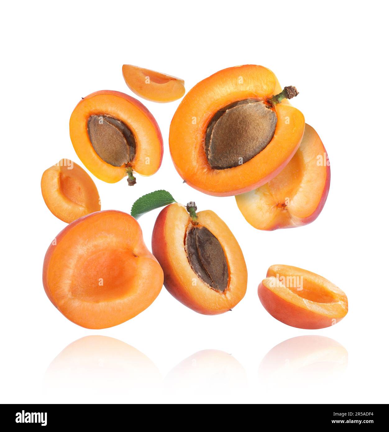 Delicious ripe sweet apricots falling on white background Stock Photo ...