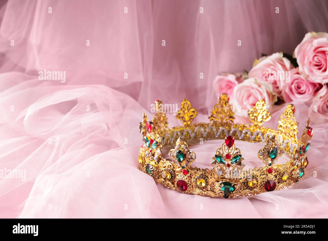 Gold crown with pink roses hi-res stock photography and images - Alamy