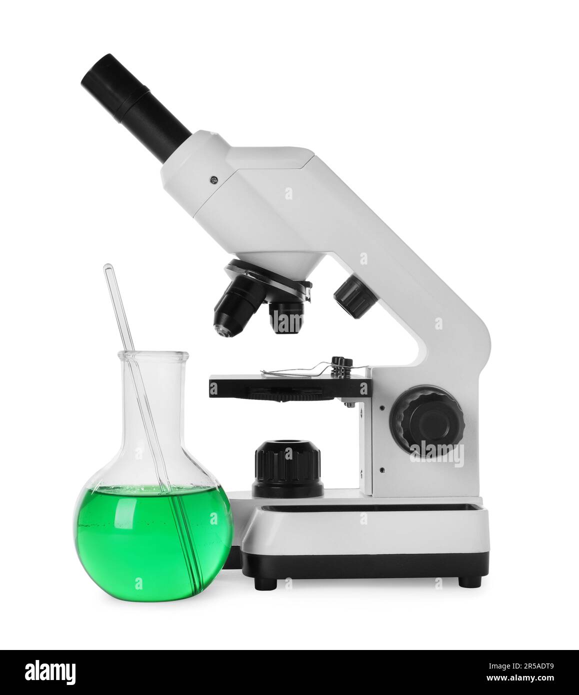 Laboratory flask with green liquid and microscope isolated on white ...
