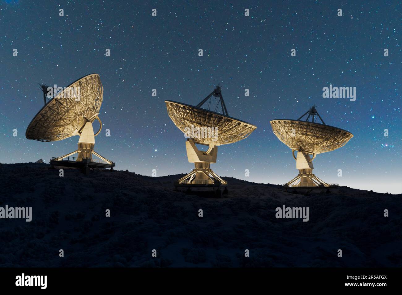 Satellite dishes on the top of the hill at night. Space observatory ...