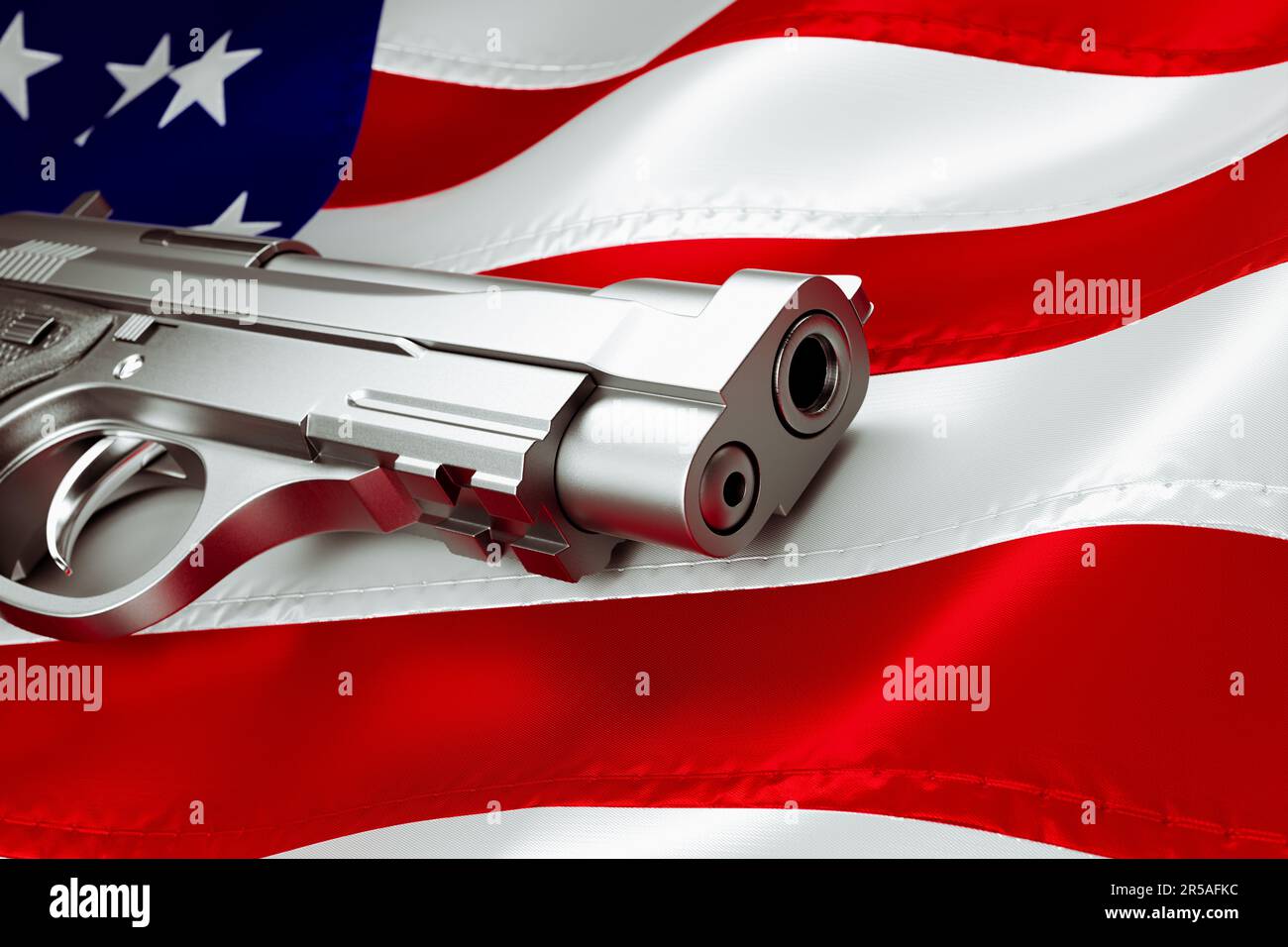 Shiny pistol with the American flag in the background. Silver gun ...