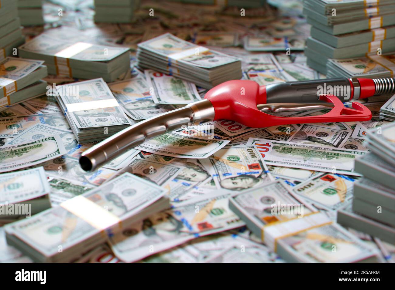 Image of gas pump nozzle with red handle among tons of dollars. Concept ...