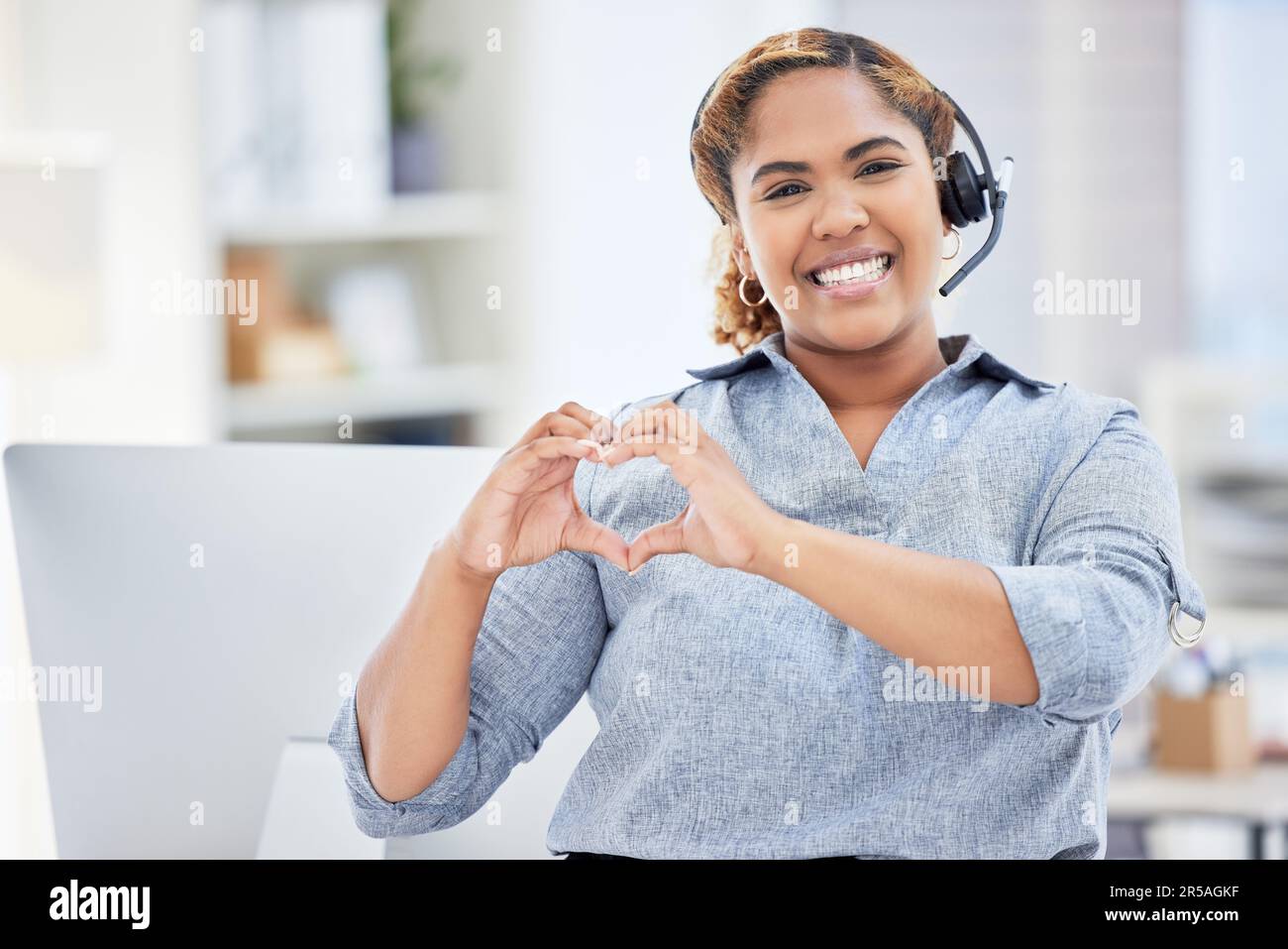 Callcenter agent, woman with smile and heart hands in portrait, love ...