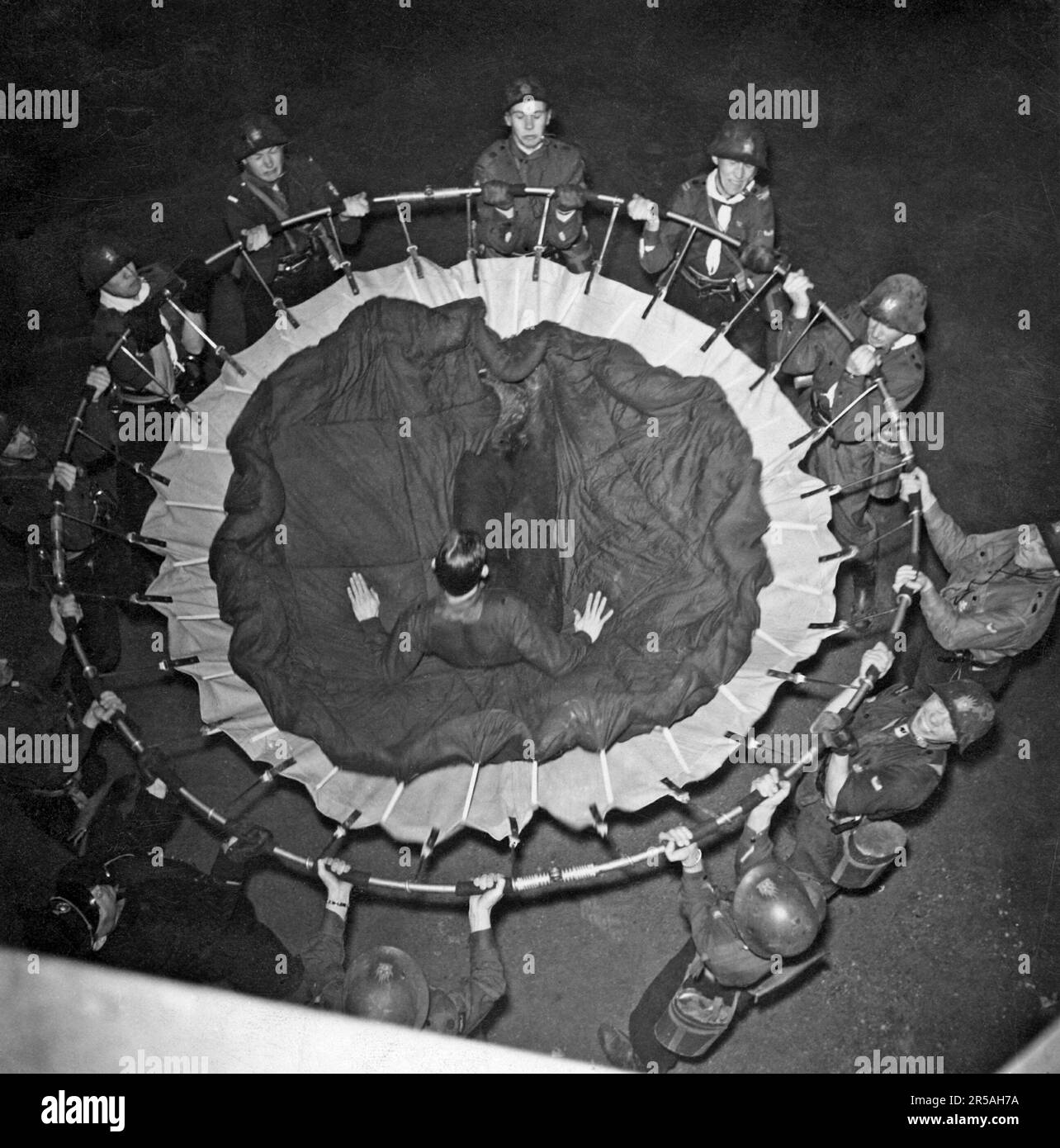 In the 1940s. A man lands in a life saving sheet. A device invented in 1887, and was until the ...