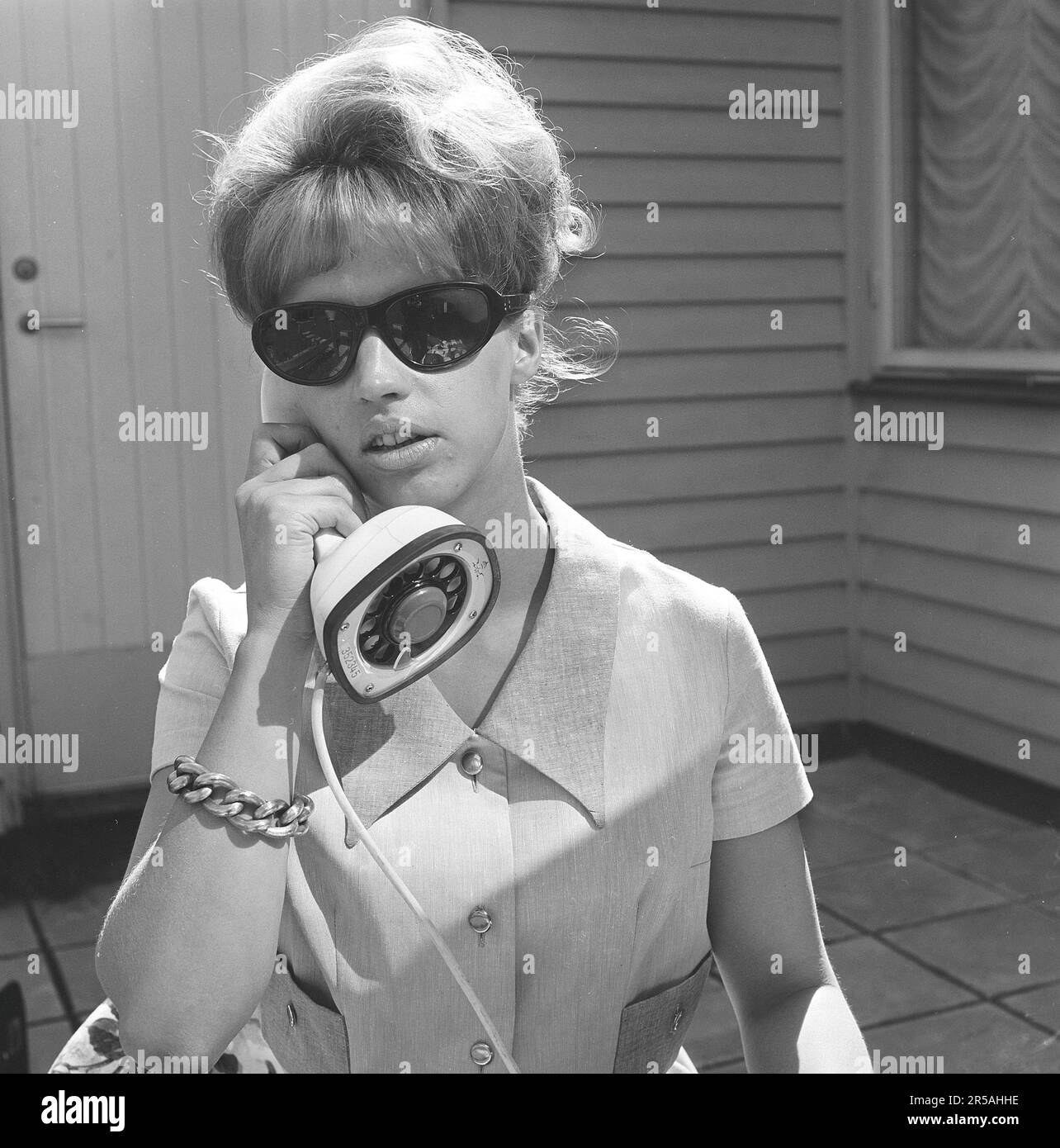 Female speaking on the phone 1960s hi-res stock photography and images ...