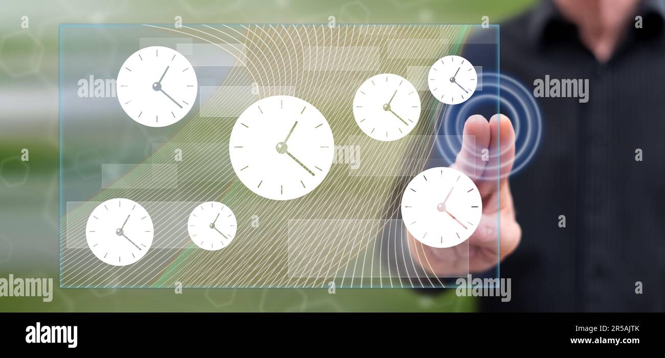Man touching a time management concept on a touch screen with his ...
