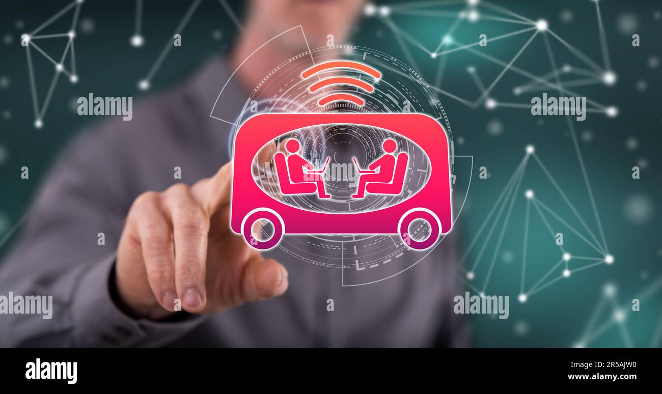 Man touching a self-driving car concept on a touch screen with his ...