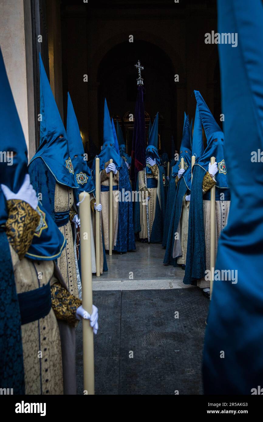 Blue capirote procession during the holy week in Grenada, Spain ...