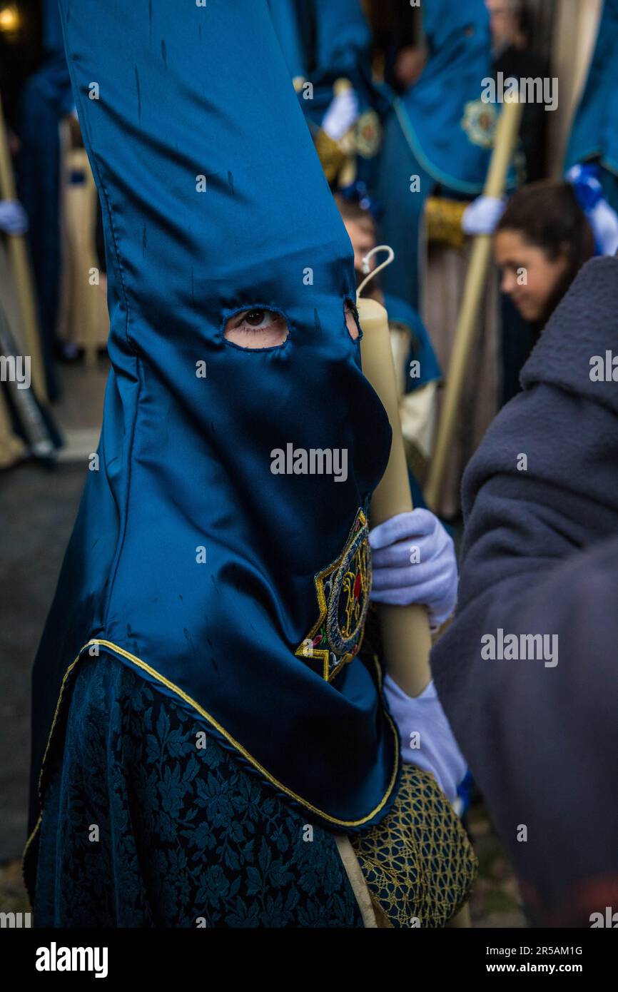 Blue capirote procession during the holy week in Grenada, Spain ...