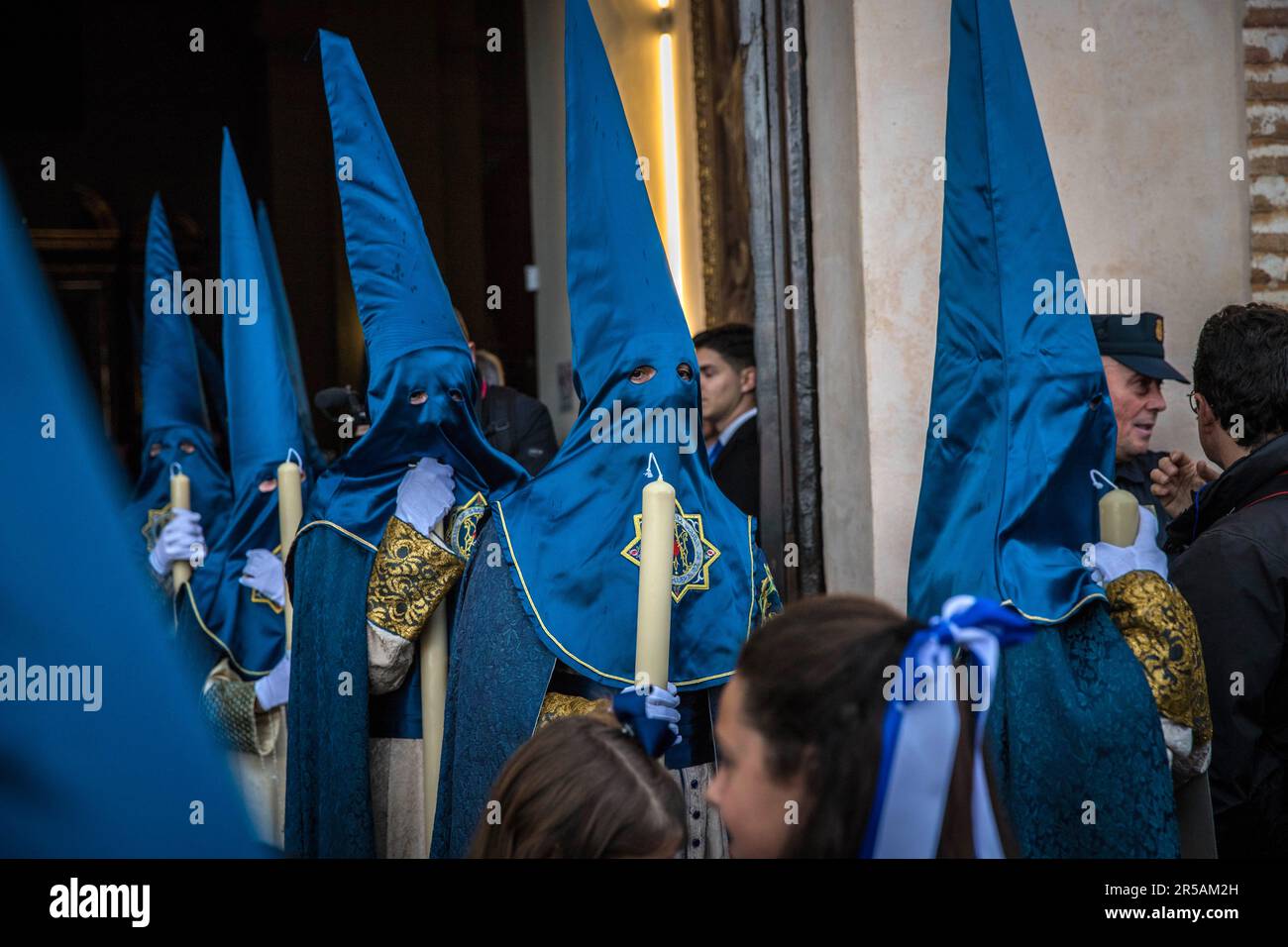 Blue capirote procession during the holy week in Grenada, Spain ...