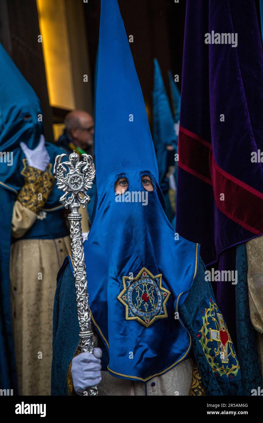 Blue capirote procession during the holy week in Grenada, Spain ...