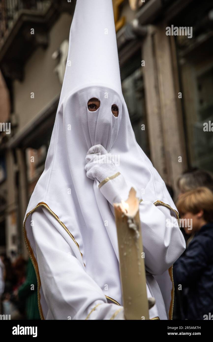 Capirotes during a procession for the holy week in Grenada, Spain ...