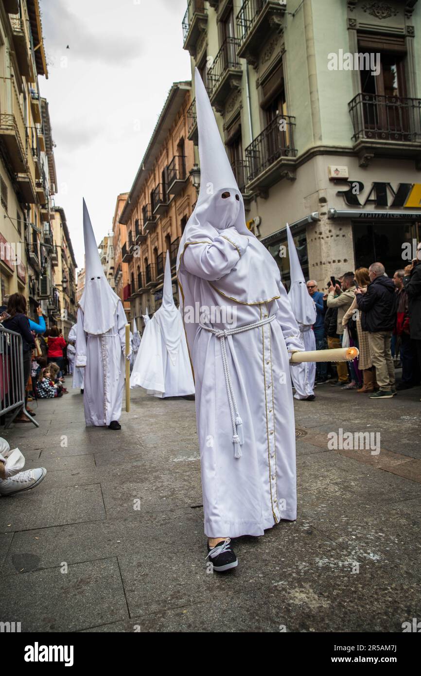 Capirotes during a procession for the holy week in Grenada, Spain ...