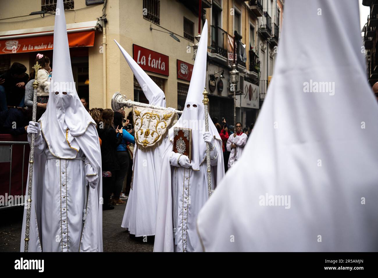 Capirotes during a procession for the holy week in Grenada, Spain ...