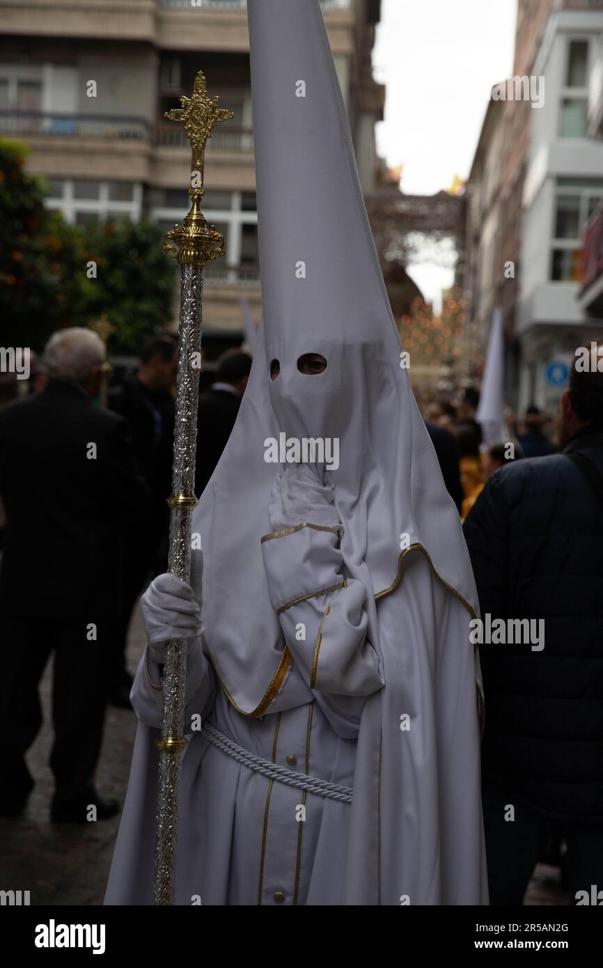 Capirotes during a procession for the holy week in Grenada, Spain ...