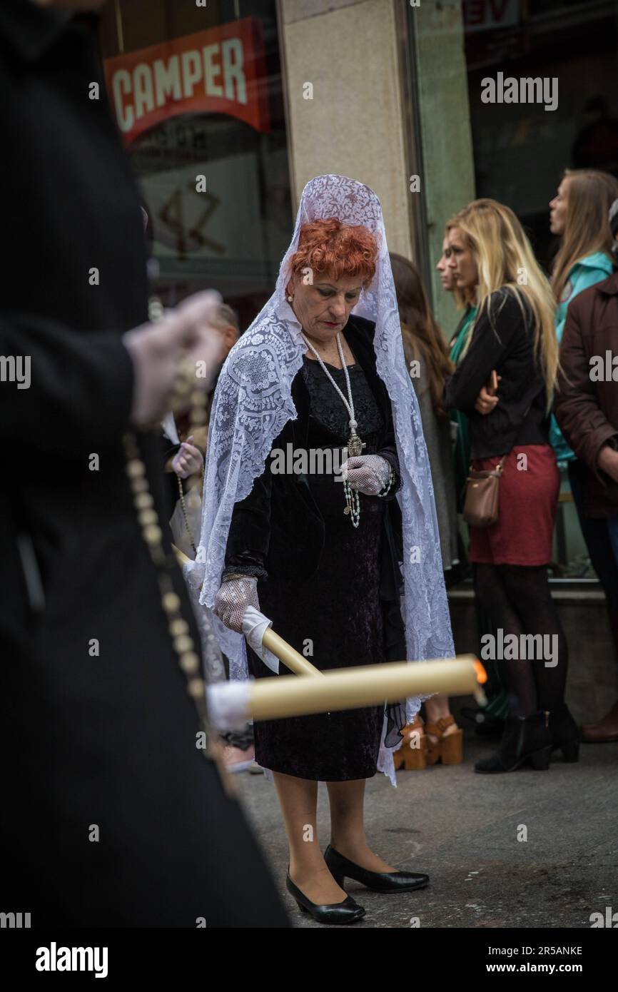 Capirotes during a procession for the holy week in Grenada, Spain ...