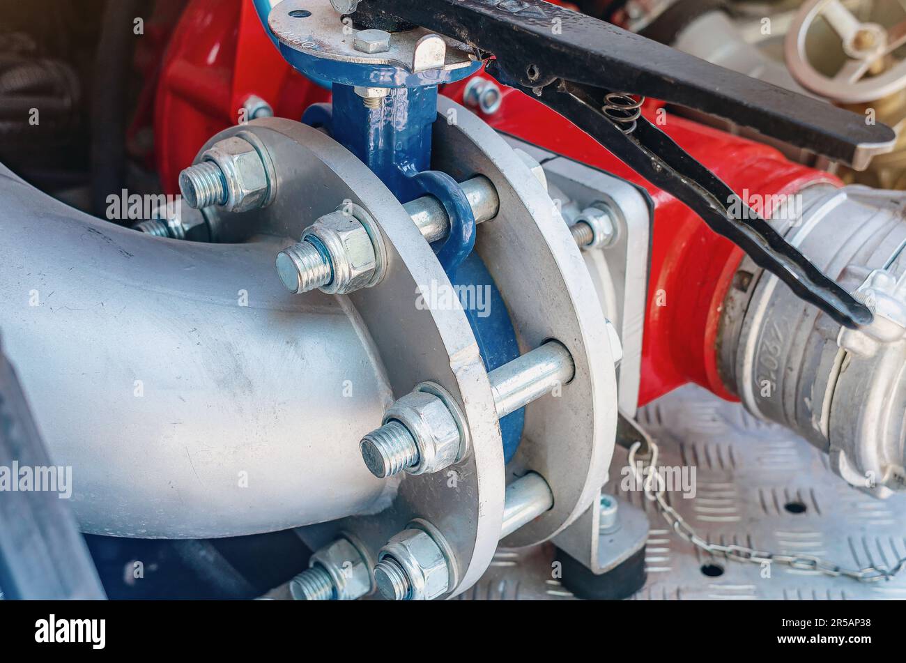 Wrench connection of metal pipes in fire truck Stock Photo - Alamy