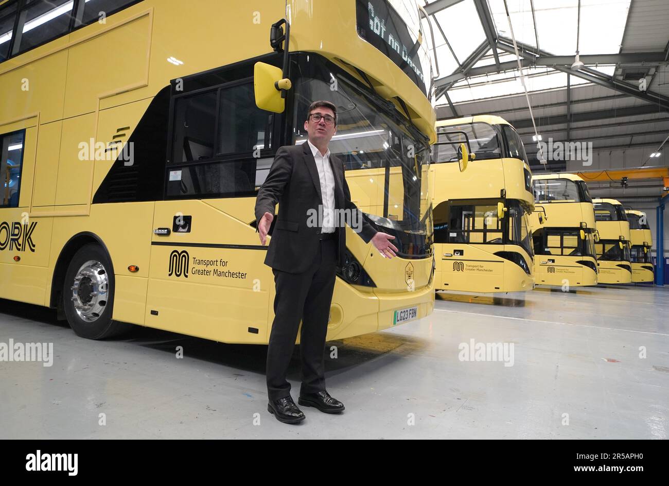 Greater Manchester mayor Andy Burnham views the 'Bee Network' buses at ...