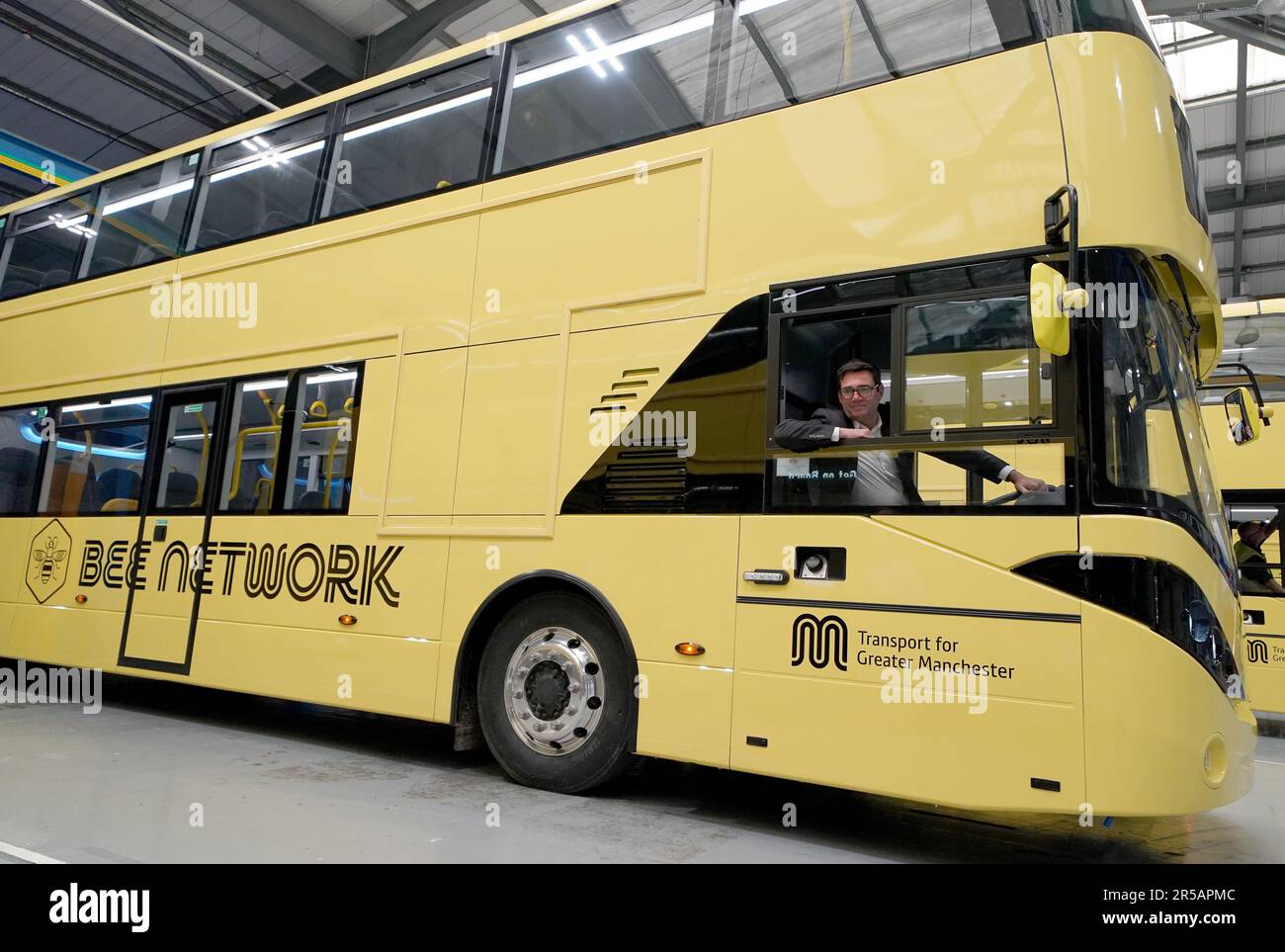 Greater Manchester mayor Andy Burnham views the 'Bee Network' buses at ...