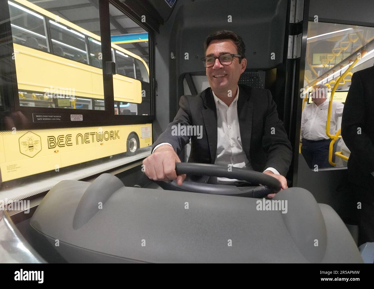 Greater Manchester mayor Andy Burnham views the 'Bee Network' buses at ...