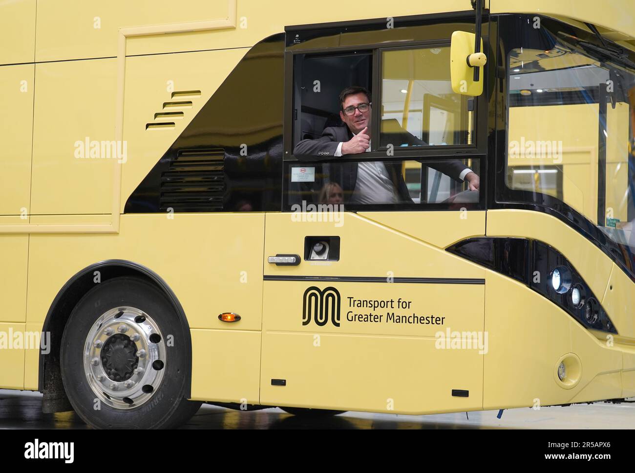 Greater Manchester mayor Andy Burnham views the 'Bee Network' buses at ...