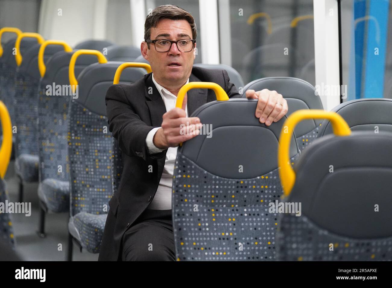 Greater Manchester mayor Andy Burnham views the 'Bee Network' buses at ...