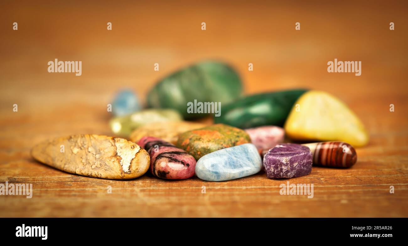 Colorful healing crystals background. Alternative chakra therapy ...