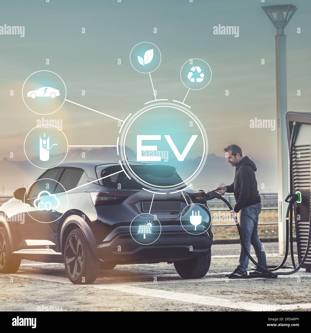 Man charging hybrid EV. Charge battery of electric vehicle. Green eco ...