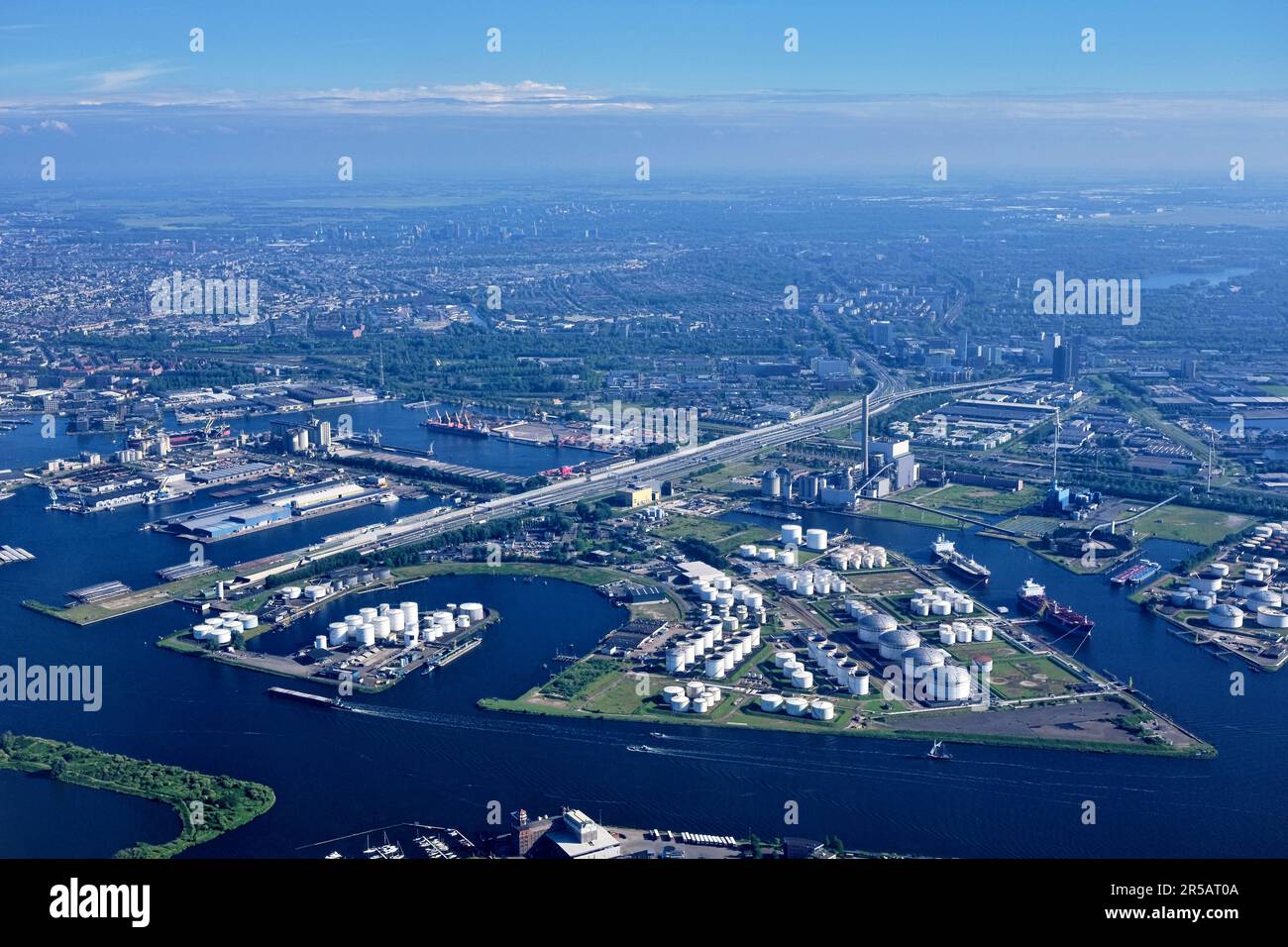 Aerial view of Noordzeecanaal with gas and oil depots in Petroleumhaven ...
