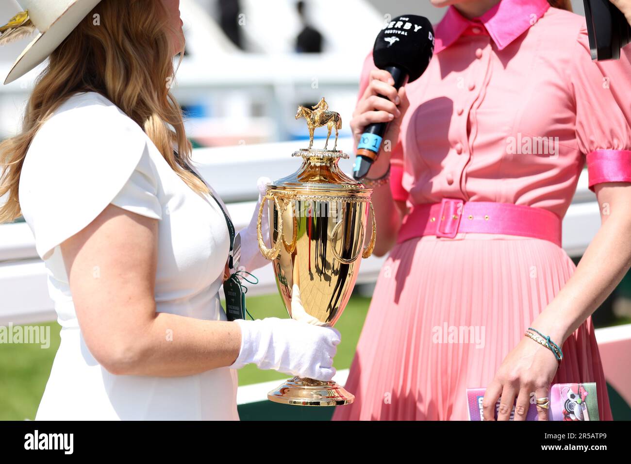 Katrina Helmer is interviewed while holding a replica of the Kentucky ...