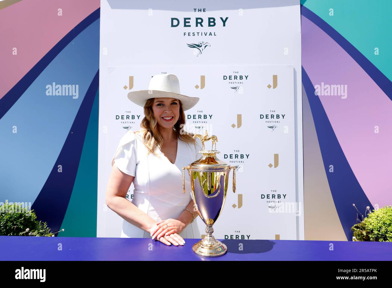 Katrina Helmer poses with a replica of the Kentucky Derby trophy during ...