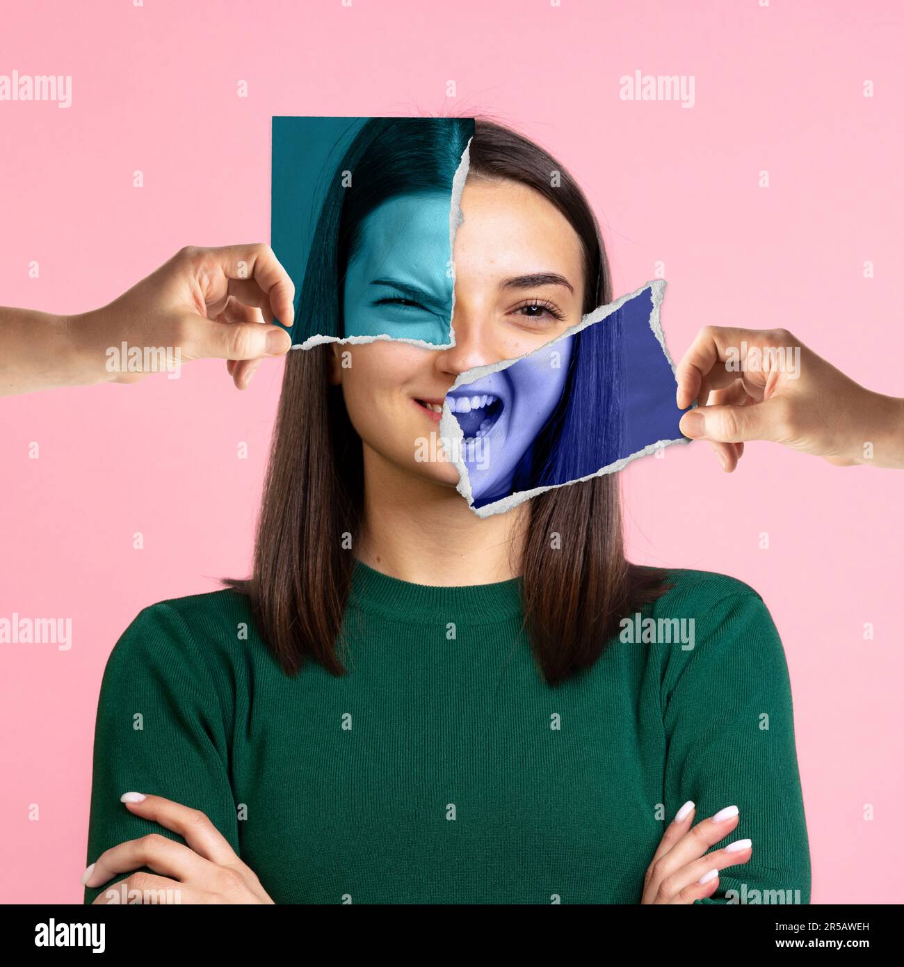 Human hands holding photo face parts with angry and happy expressions ...