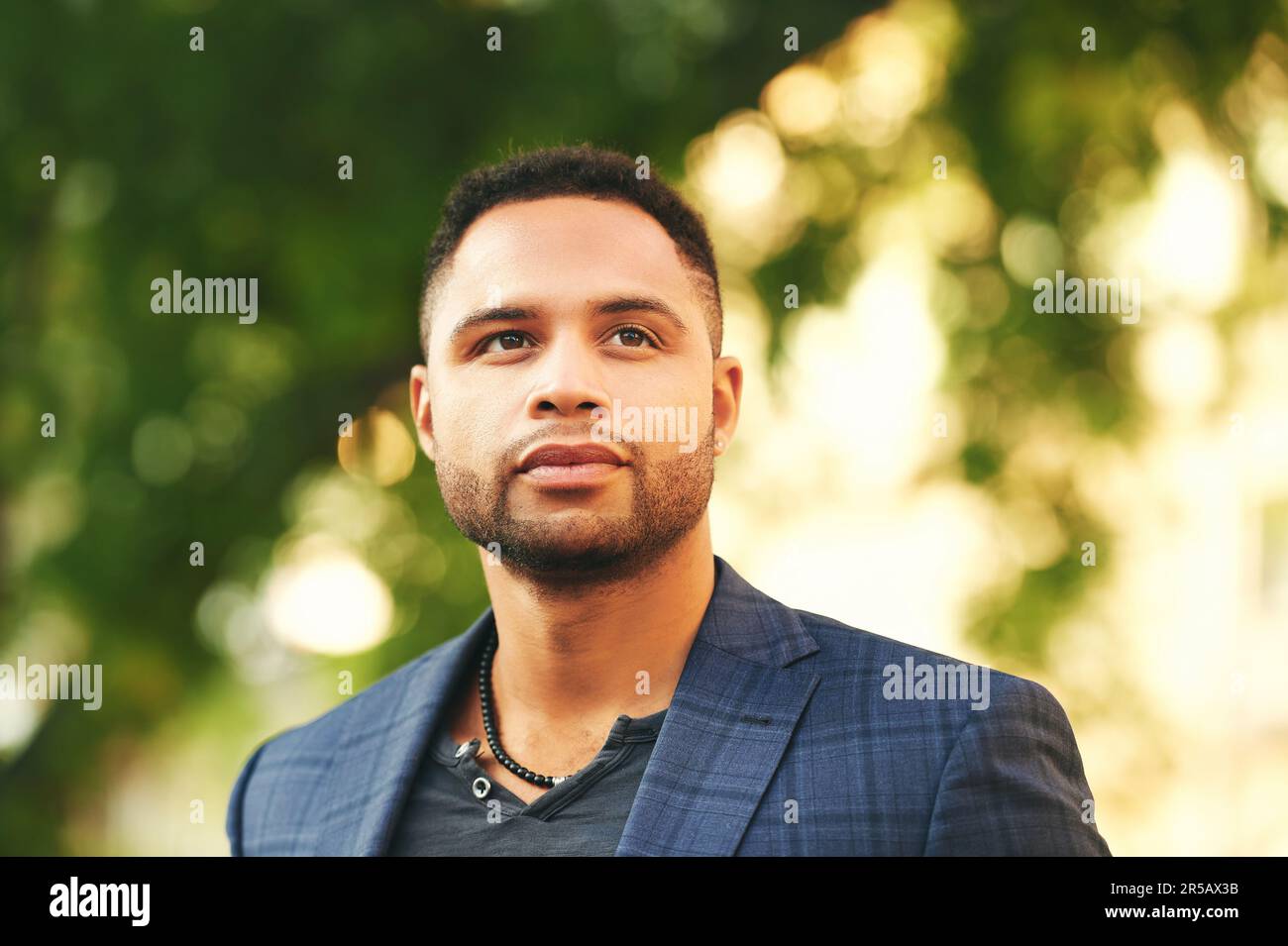 Handsome guy standing sunset hi-res stock photography and images - Alamy