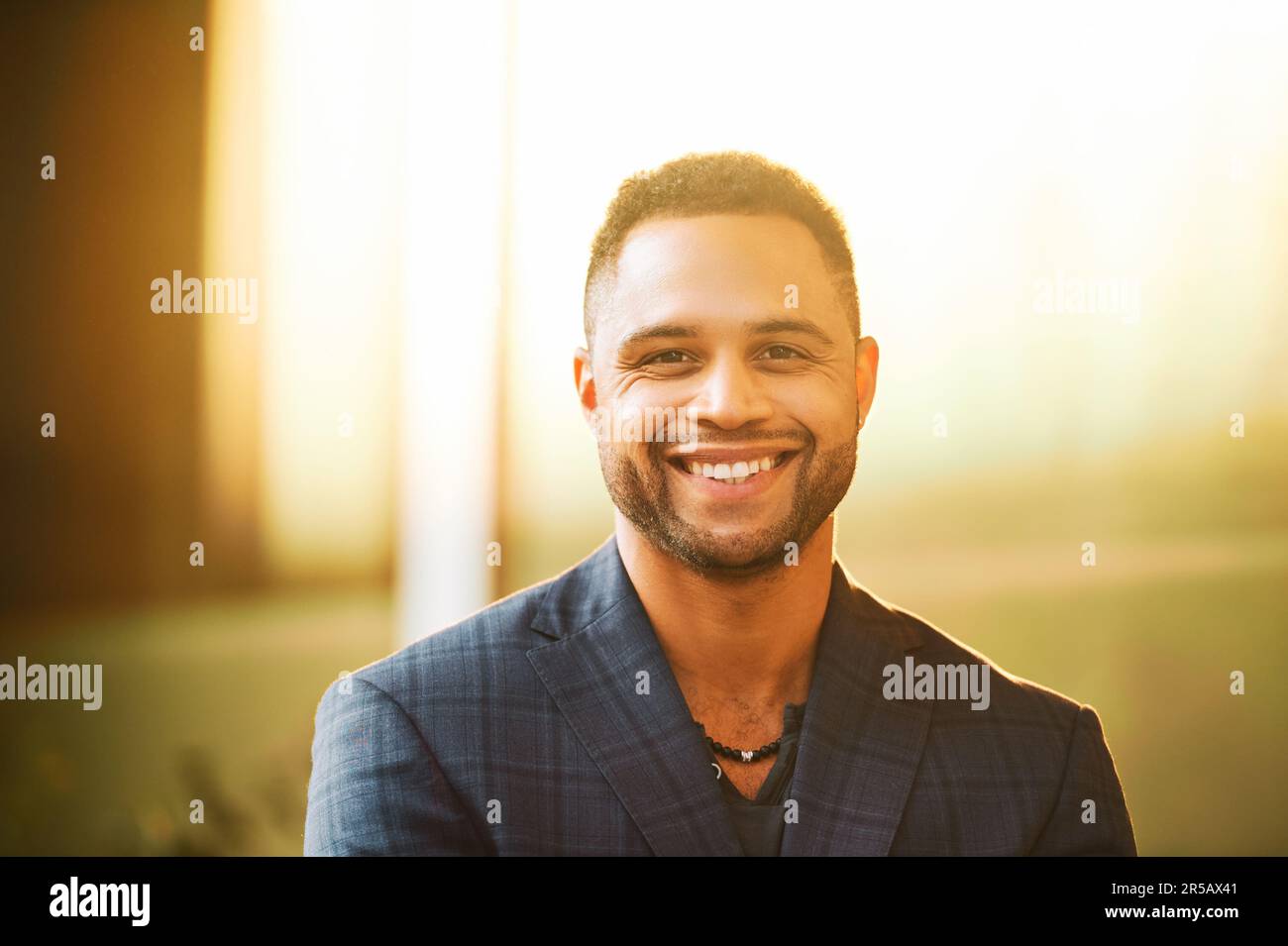 Handsome guy standing sunset hi-res stock photography and images - Alamy