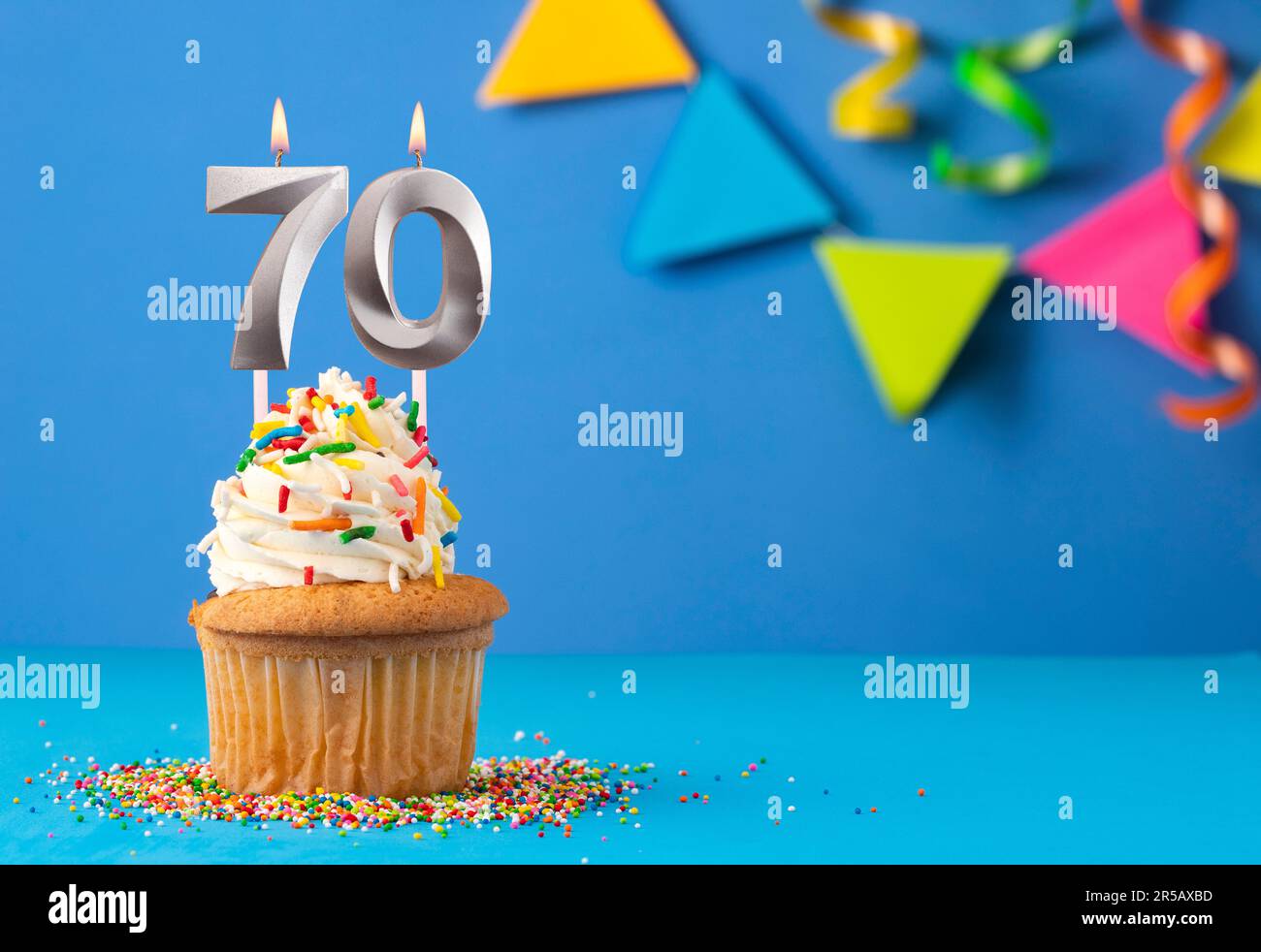 Candle number 70 - Cake birthday in blue background Stock Photo - Alamy