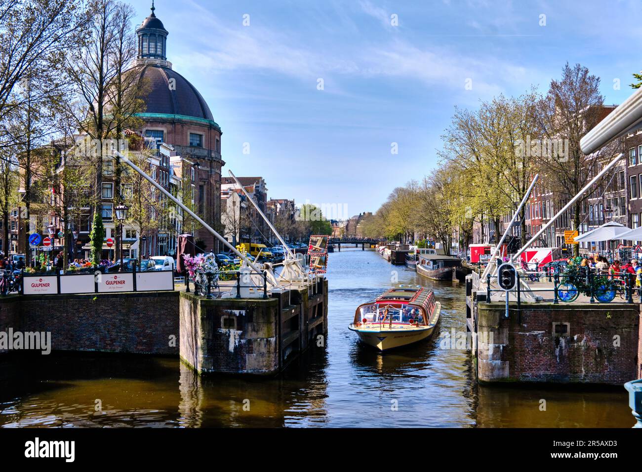 Amsterdam, Netherlands - April 12, 2022: Cruise boat on Singel canal ...