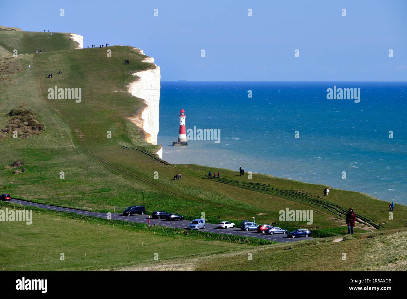View of Beachy Head lighthouse, South Downs with blue sea & skies ...