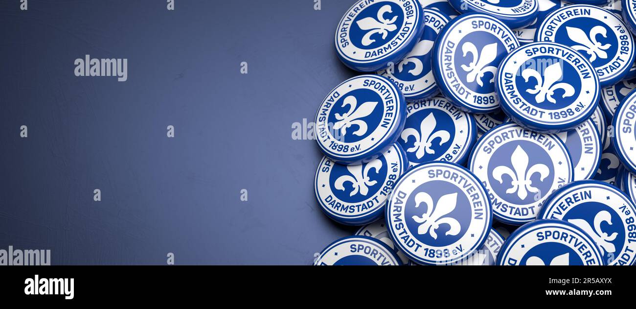 Logos of the German Soccer Club SV Darmstadt 1898 on a heap on a table ...