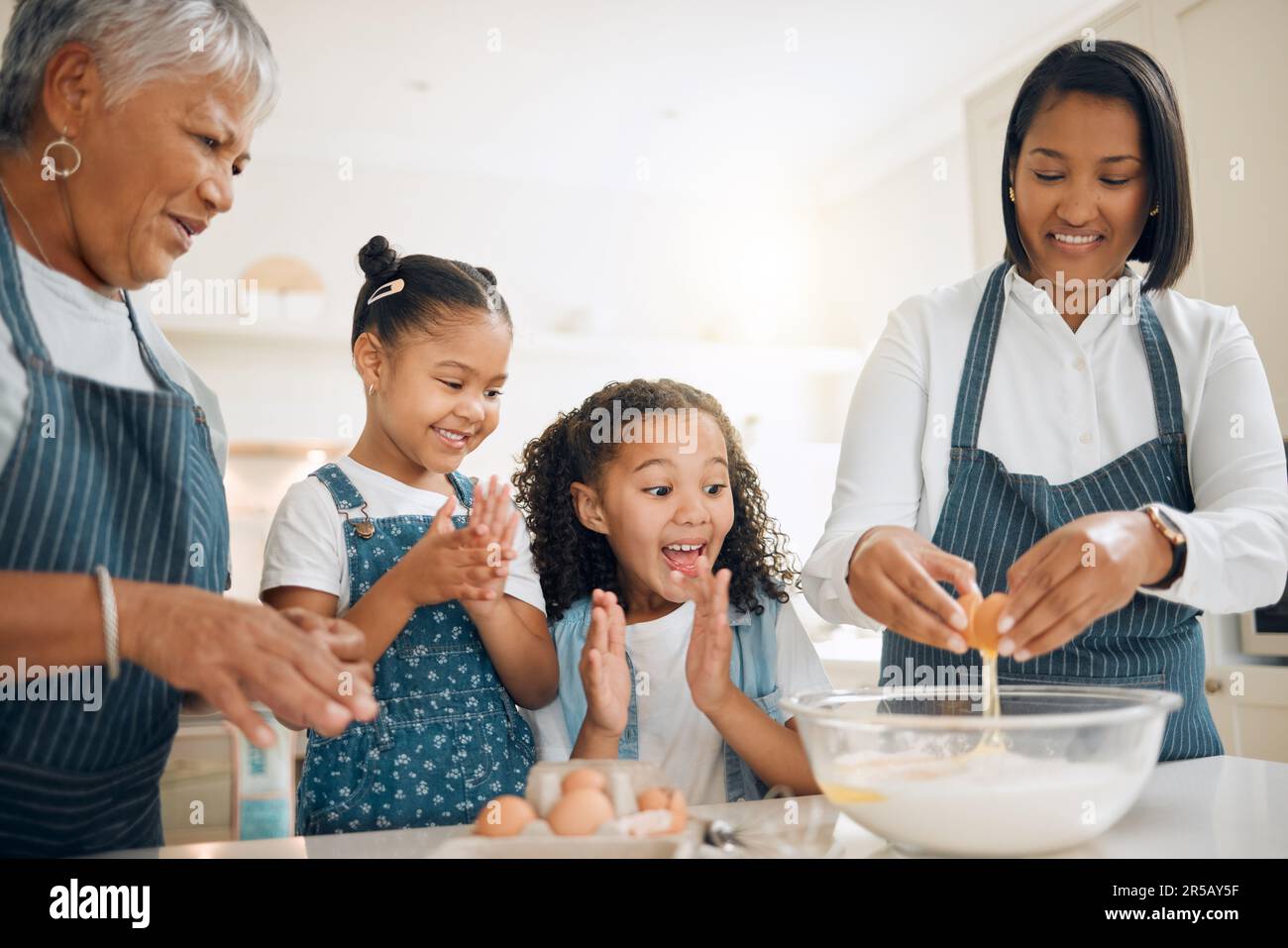 Grandmother, mom or excited children baking in kitchen as a happy ...