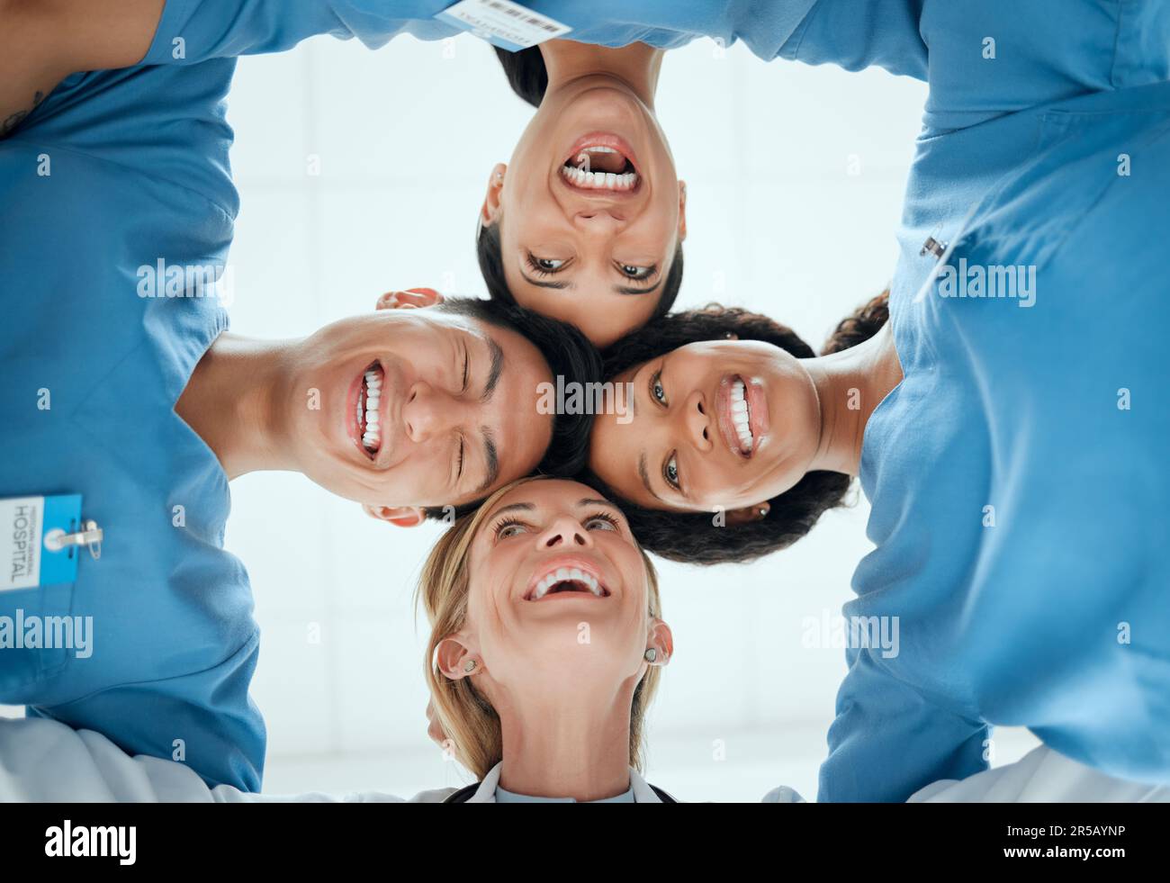 Smile, teamwork or faces of doctors in huddle laughing in collaboration together for healthcare ...