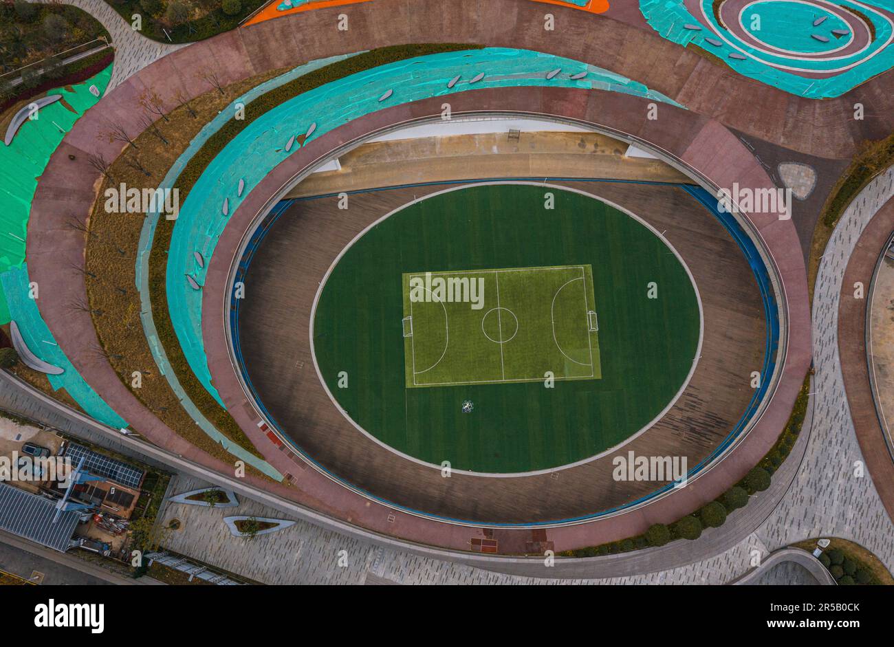 This stock photo features a tennis court in a circular structure ...