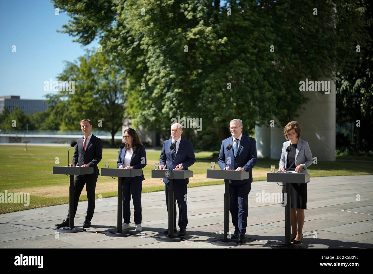 German Chancellor Olaf Scholz, center, attends a news conference with ...