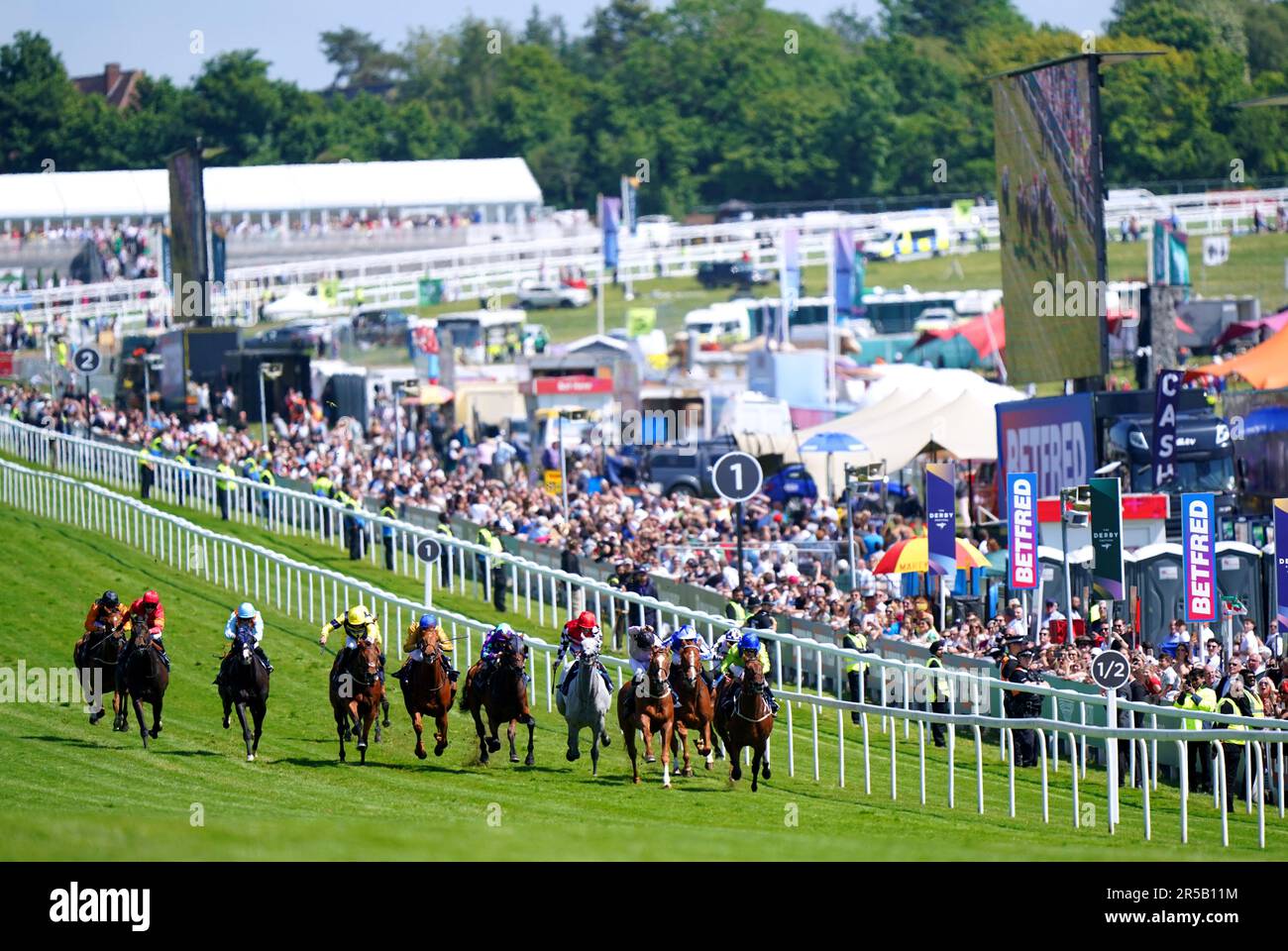 Runners and riders in action as they compete in the Racehorse Lotto ...