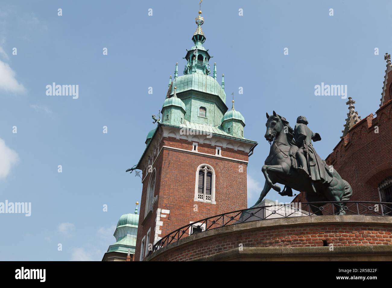 The Wavel royal castle in Krakow, Poland with a monument in front of ...