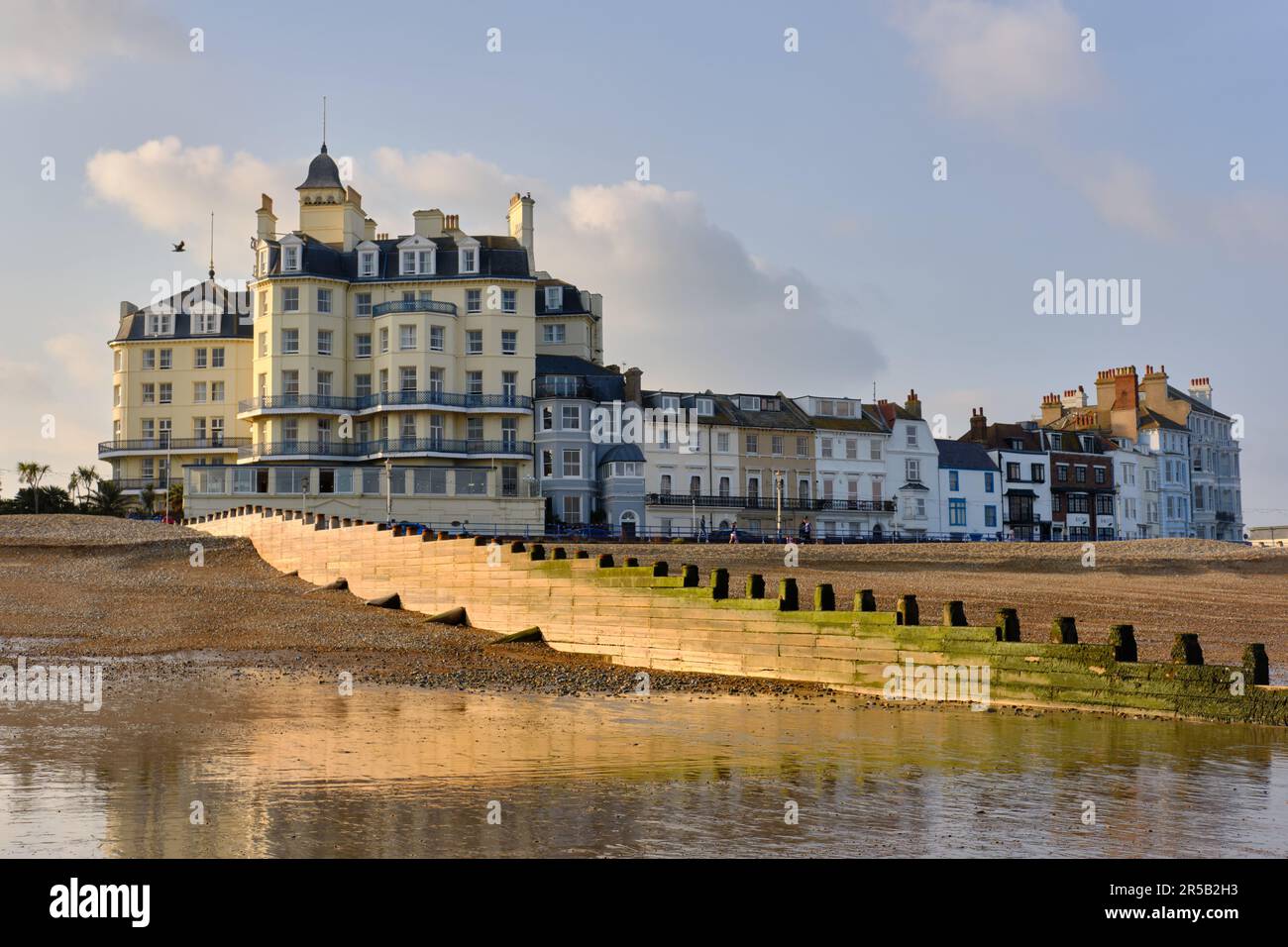 Victorian hotel buildings on the seafront in Eastbourne under a clear ...