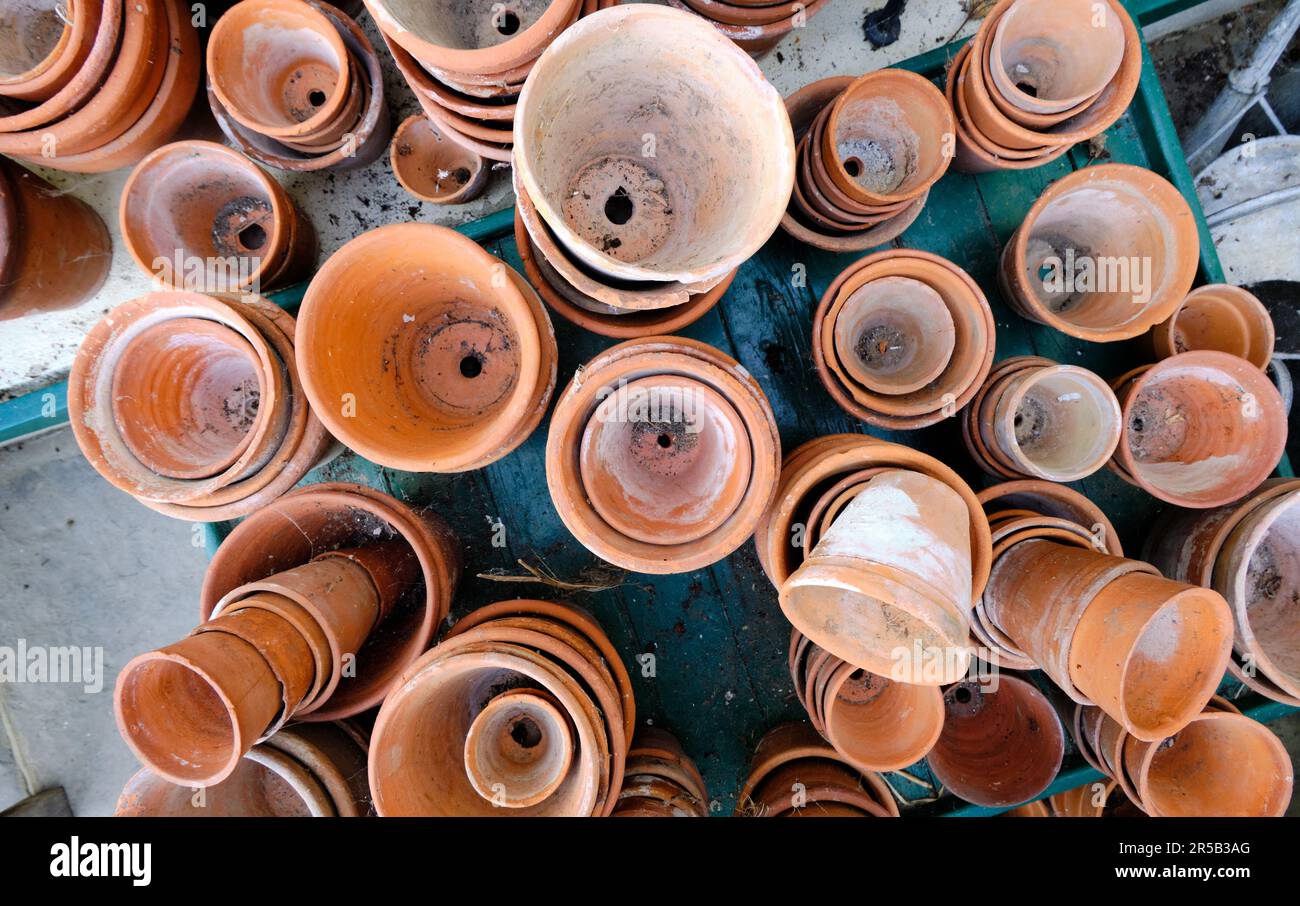 Flower pots; random piles and stacks of vintage terracotta flowerpots ...