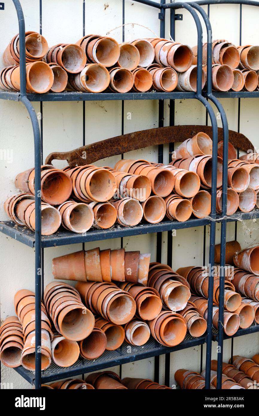 Flower pots; random piles and stacks of vintage terracotta flowerpots ...